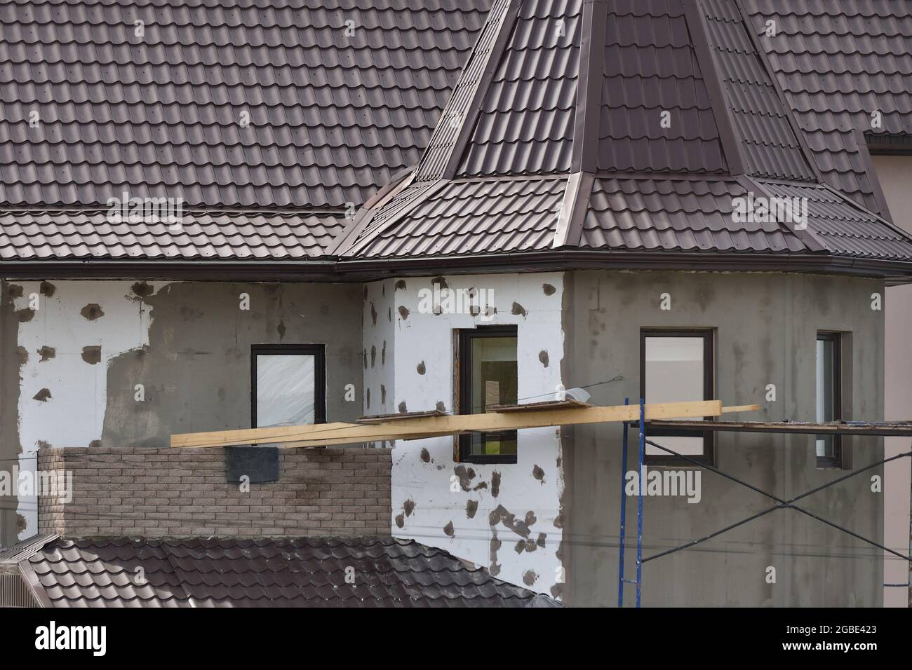 External insulation of the walls of the house with white expanded ...