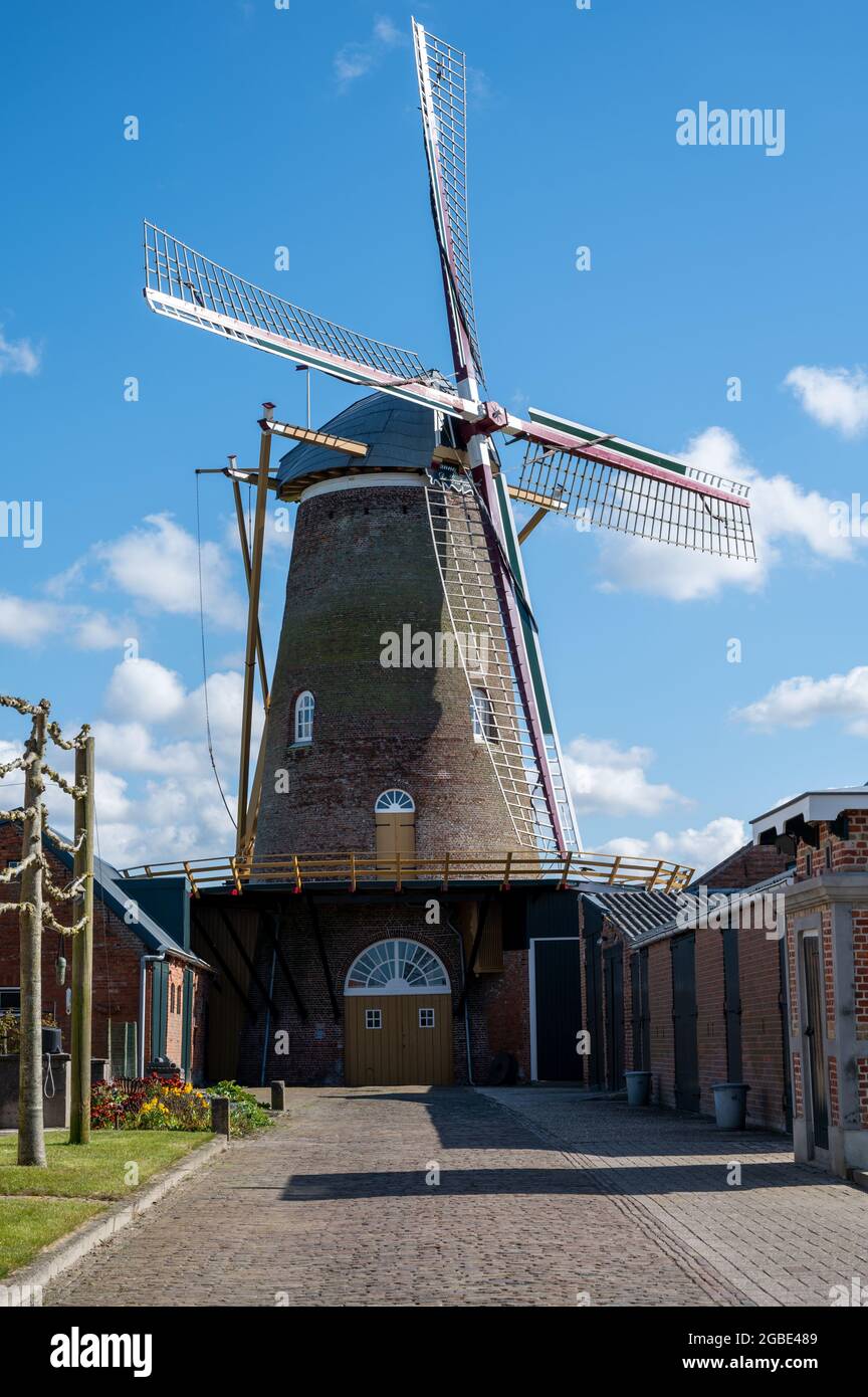 Traditional Dutch windmill used for grain grinding in sunny day Stock ...