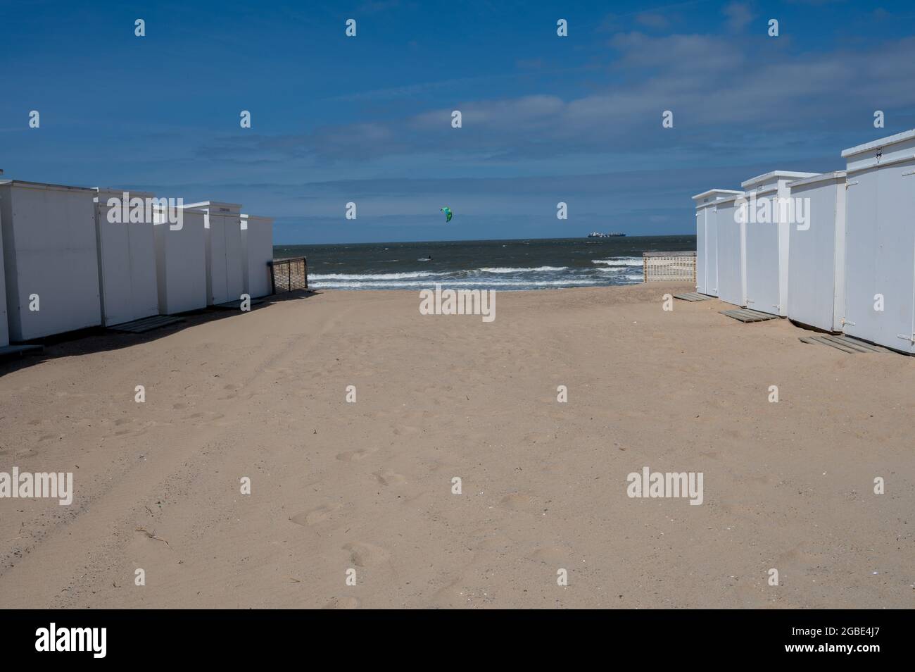 White beach huts on yellow sandy beaches in small Belgian town Knokke ...