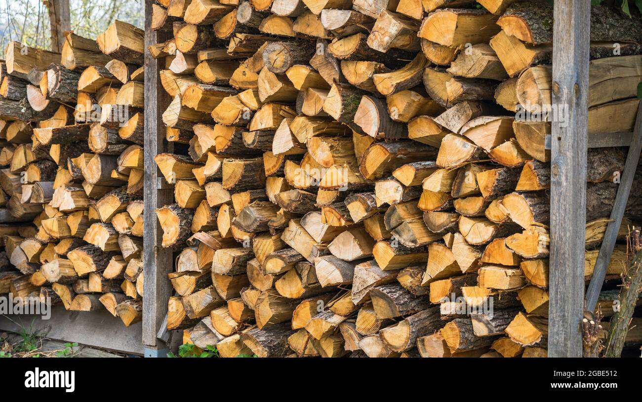 Horizontal shot of firewood store Stock Photo - Alamy
