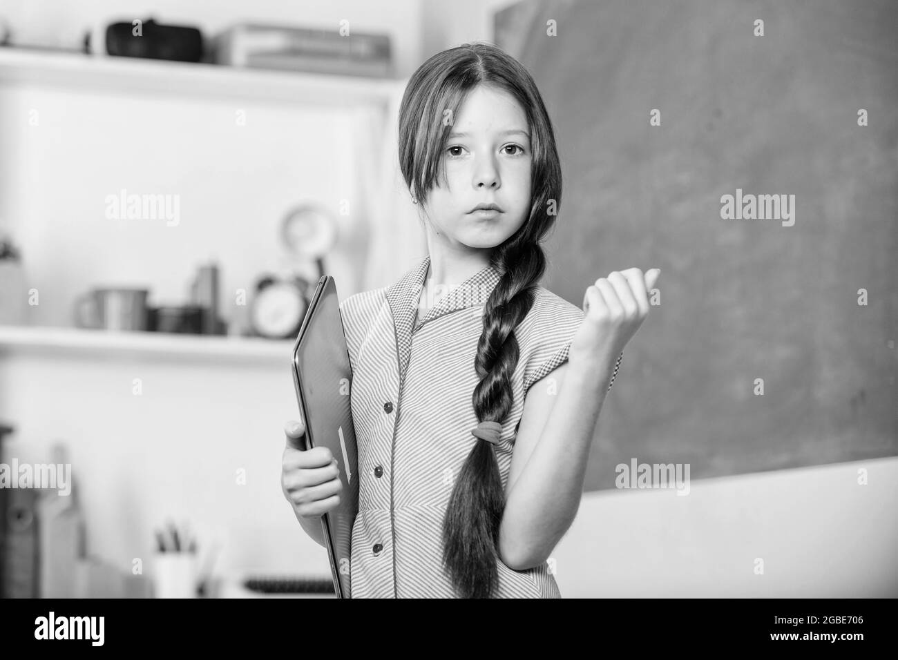 power in hand. small girl pupil with laptop. 4G and 3G internet ...