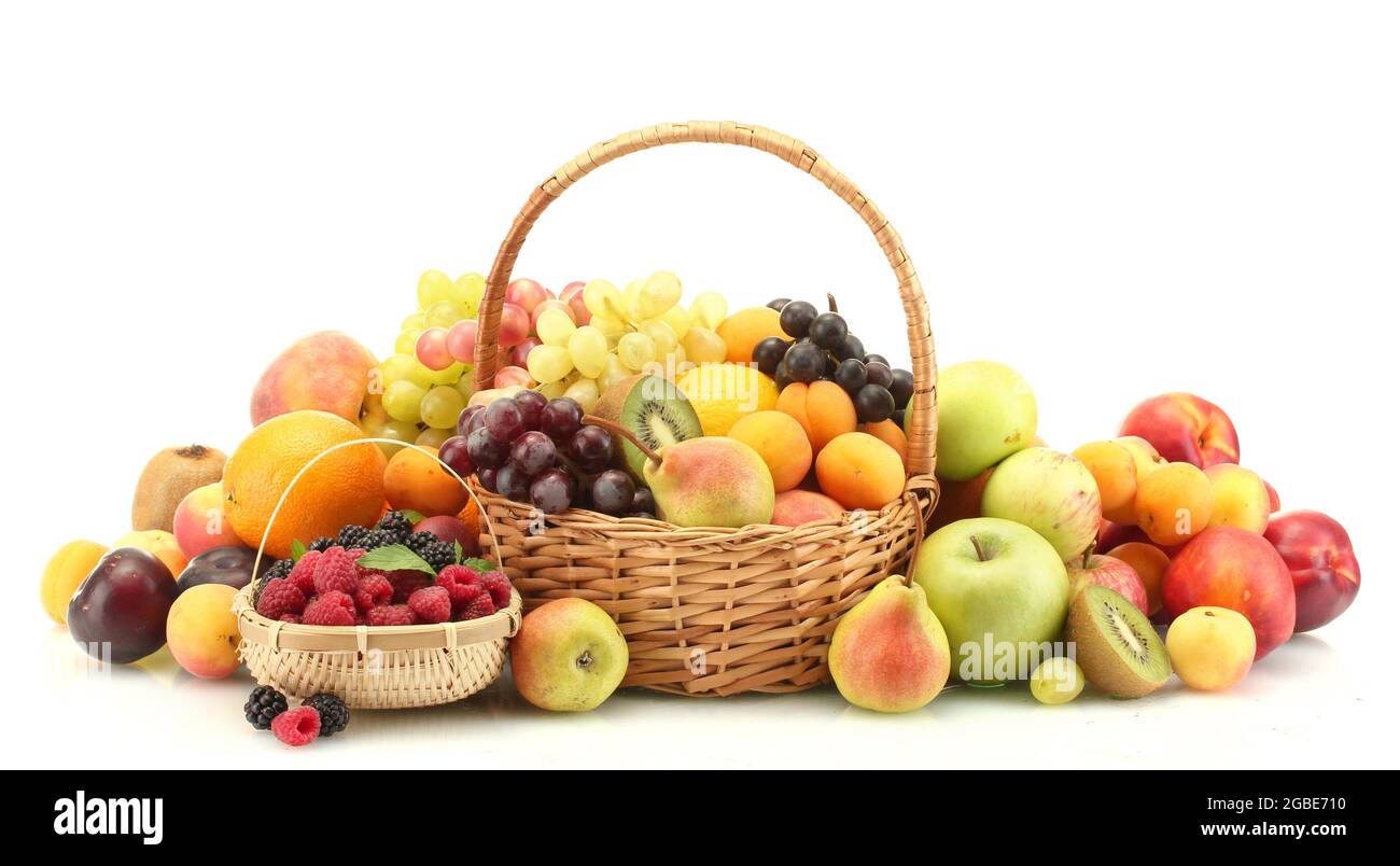 Assortment of exotic fruits and berries in baskets isolated on white ...