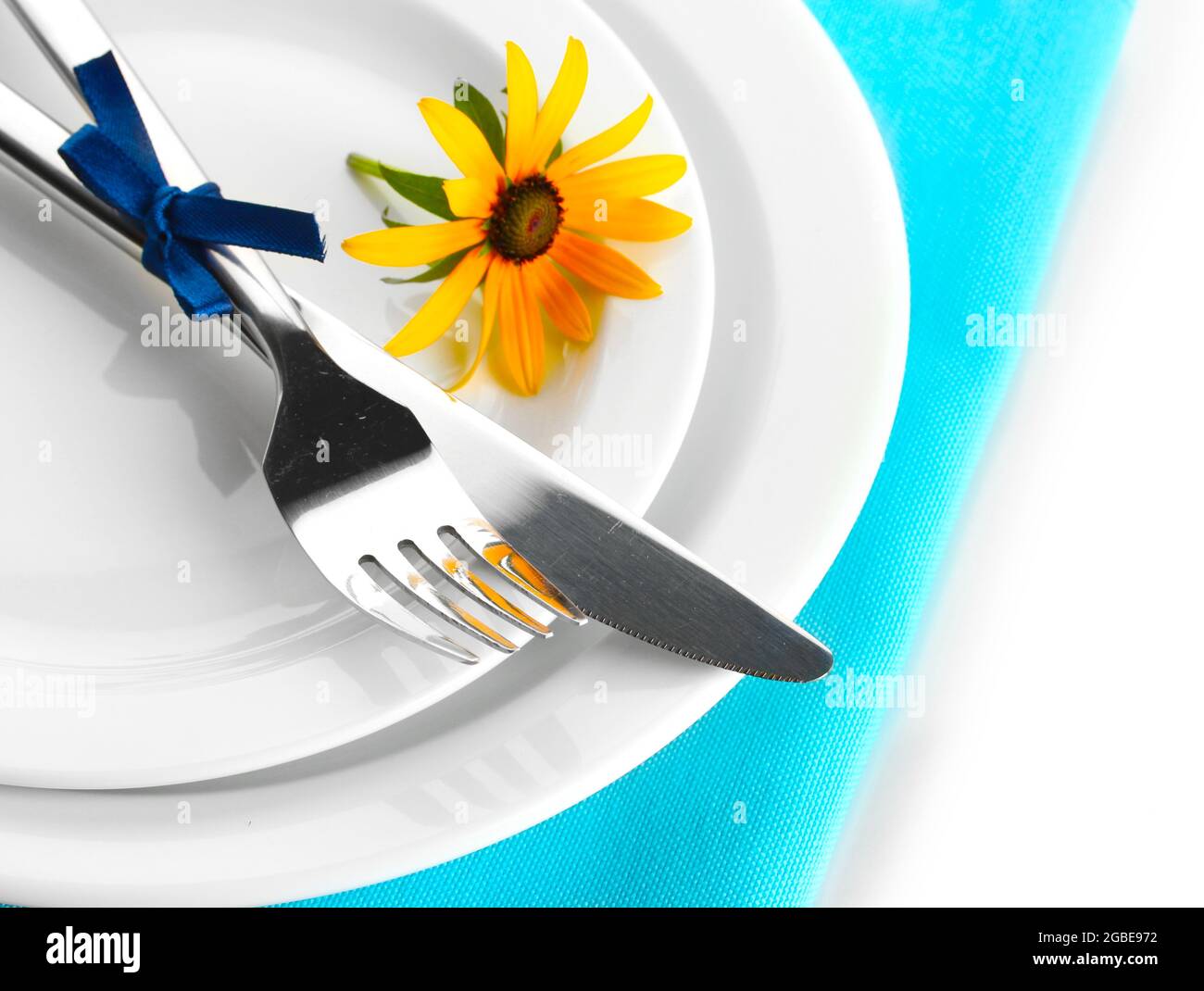 knife, fork and flower on plate, isolated on white Stock Photo - Alamy