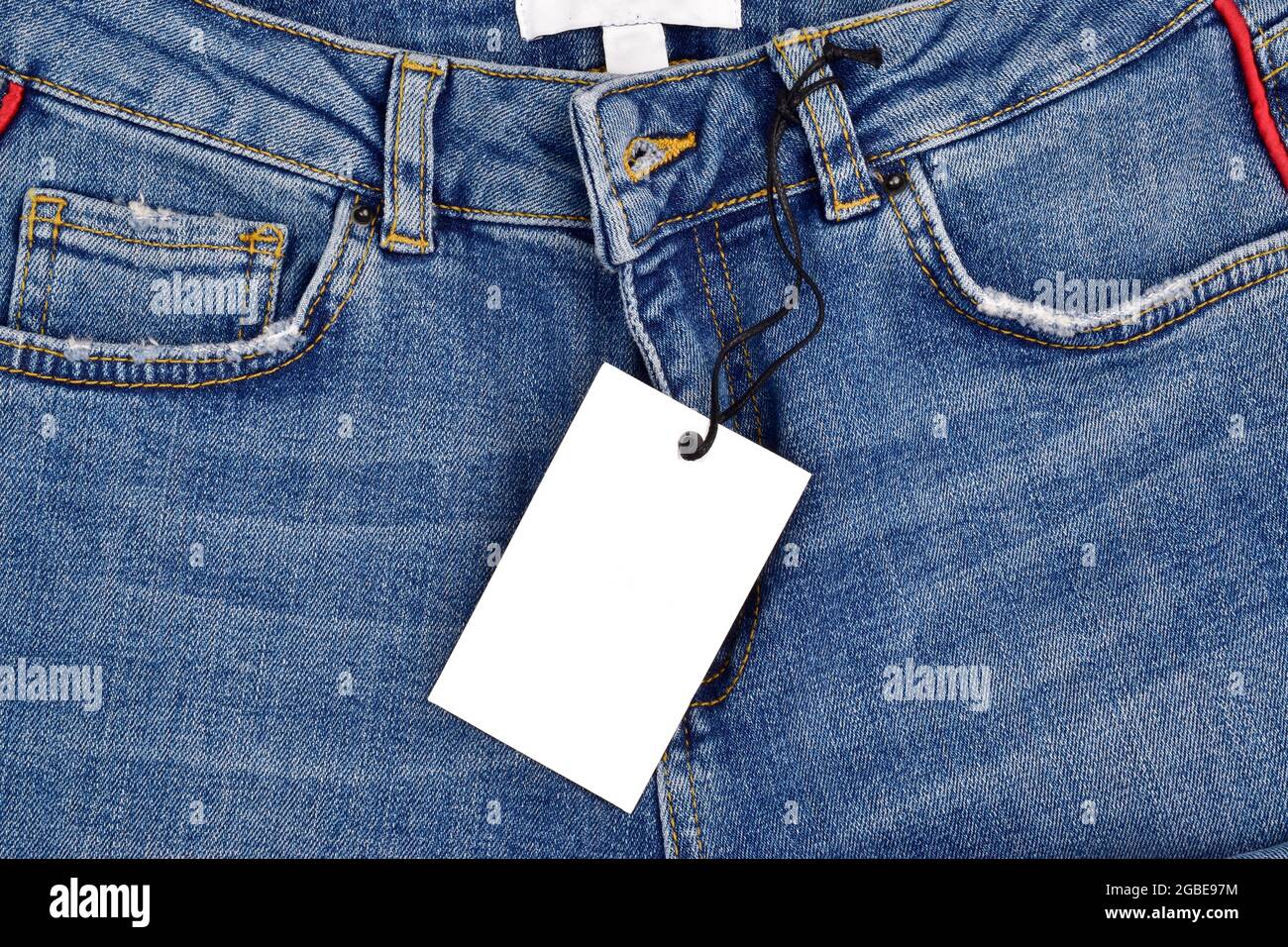 Blank Price tag On Denim Jeans Stock Photo - Alamy