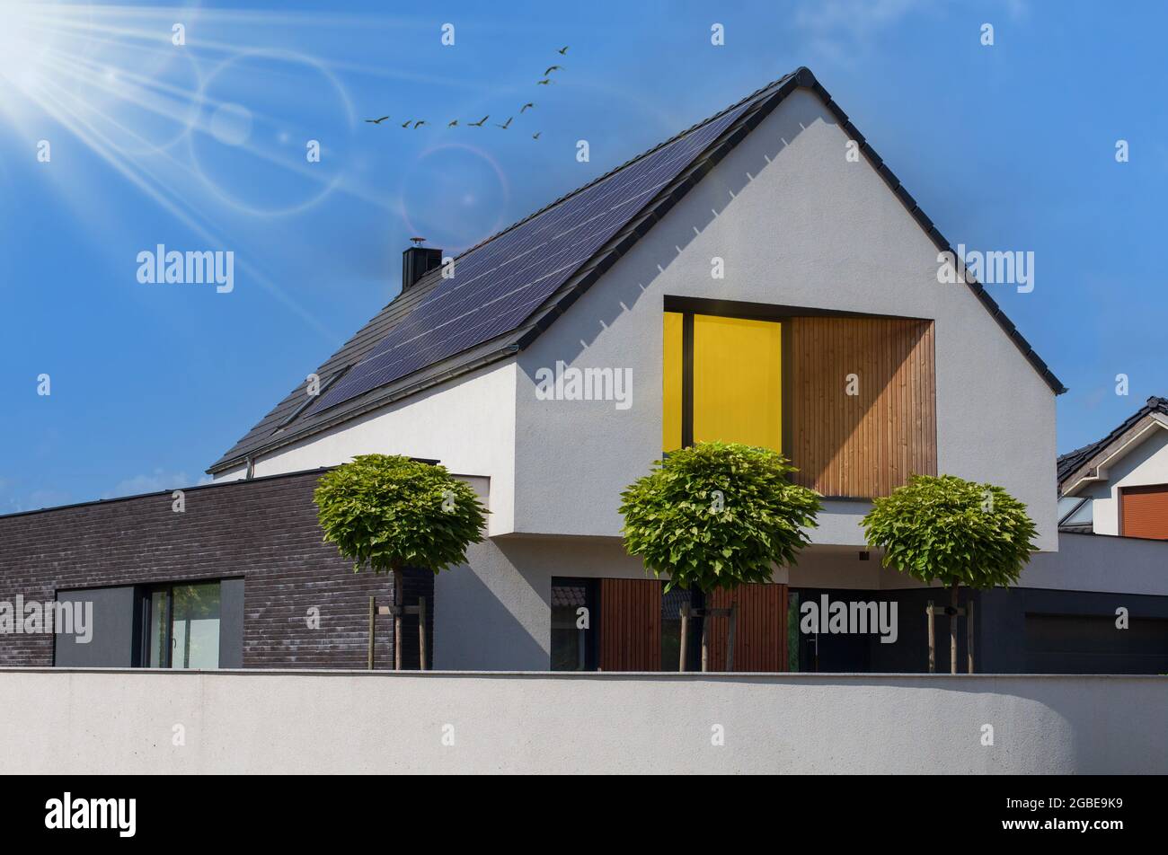 Solar panels on the roof. Beautiful modern house and solar energy. The ...