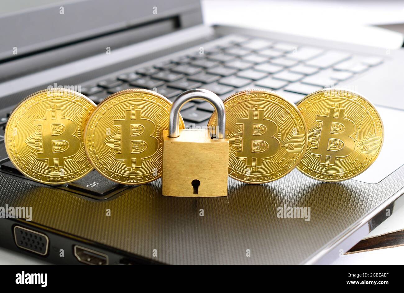 bitcoin security concept. Gold coin with padlock on laptop, blockchain ...