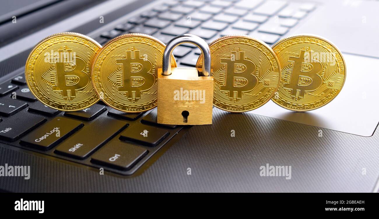 bitcoin security concept. Gold coin with padlock on laptop, blockchain ...