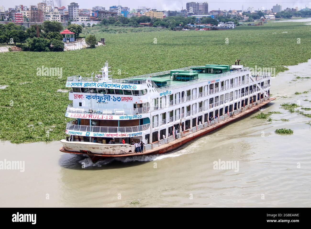 Local Passenger ferry returning to Dhaka river port. Ferry is a very ...