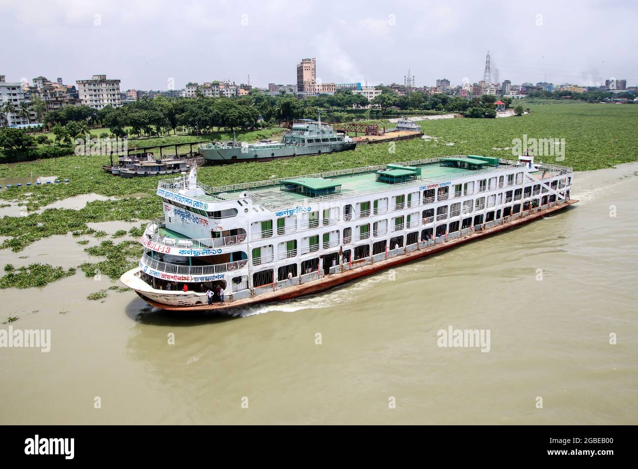 Local Passenger ferry returning to Dhaka river port. Ferry is a very ...