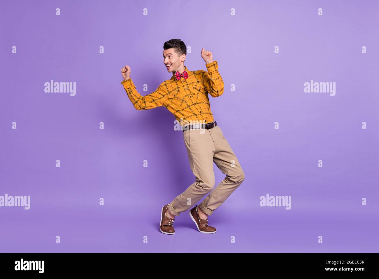 Full size photo of young man happy positive smile have fun enjoy music ...