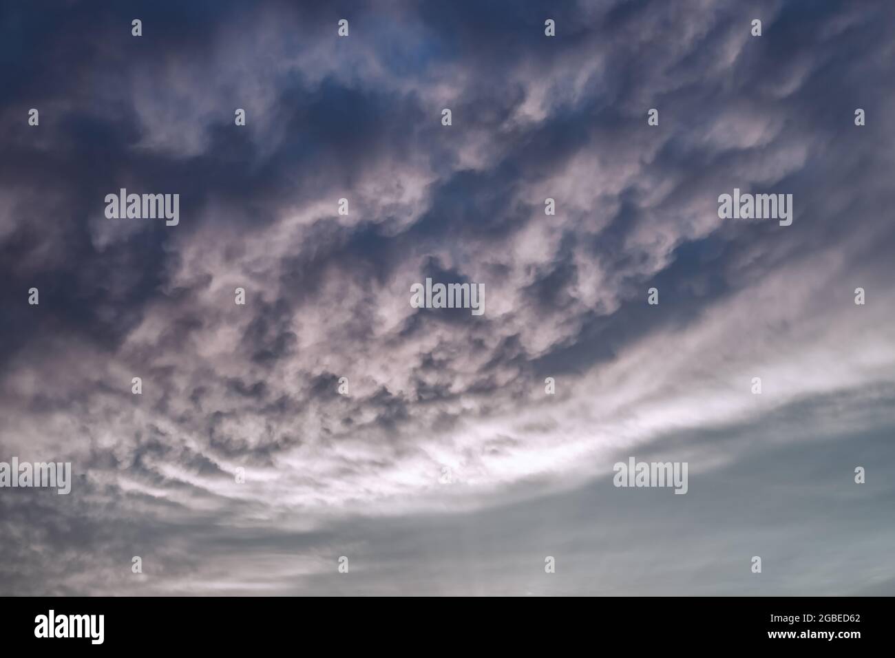 Dark dramatic clouds in the evening sky. Thunderclouds in bad weather ...
