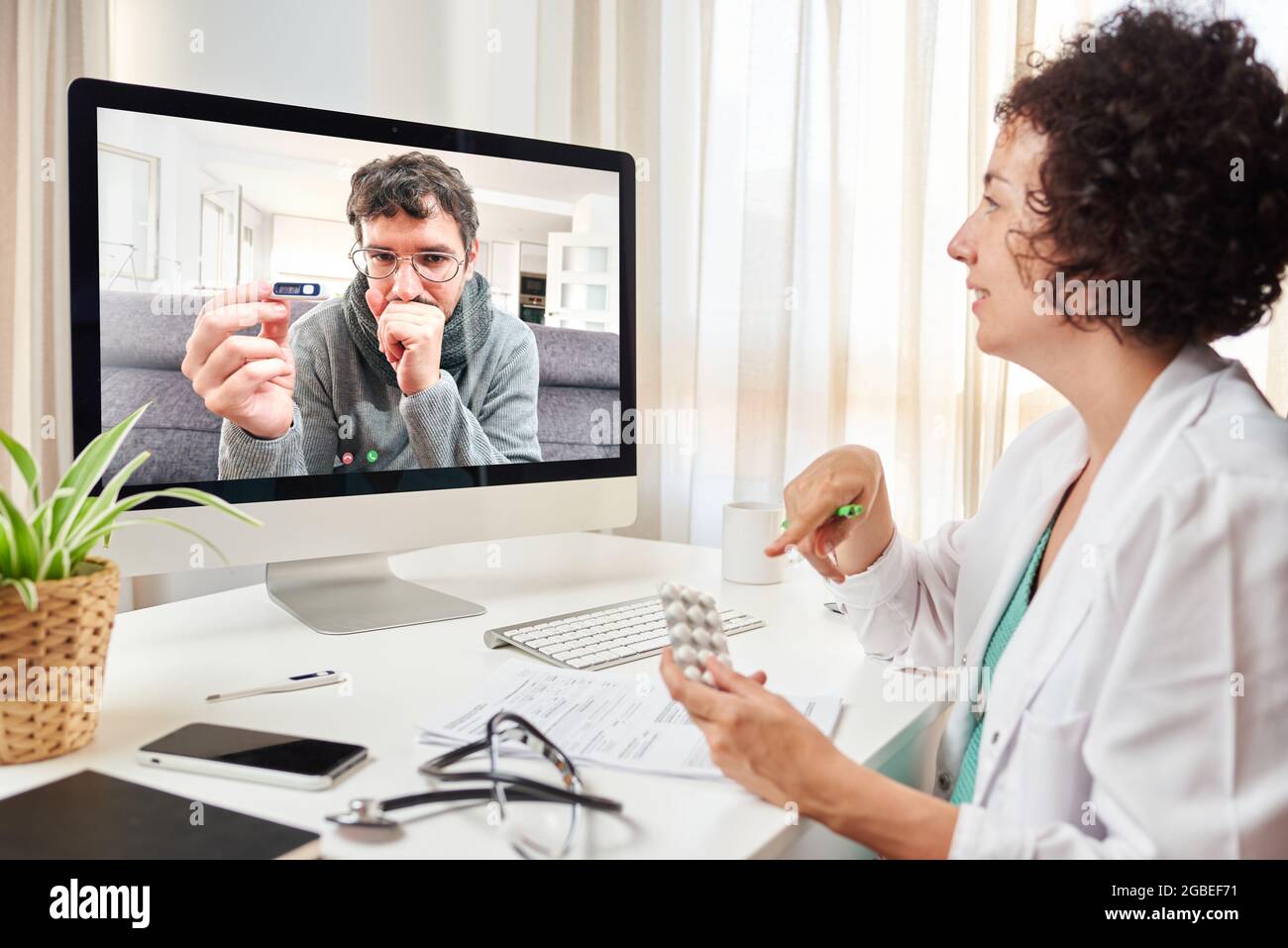 Woman flu using video call hi-res stock photography and images - Alamy