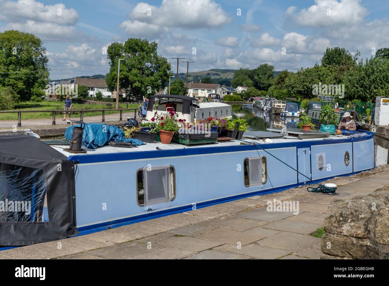 Flower pots on top of a barge on the Leeds Liverpool Canal at Bingley ...