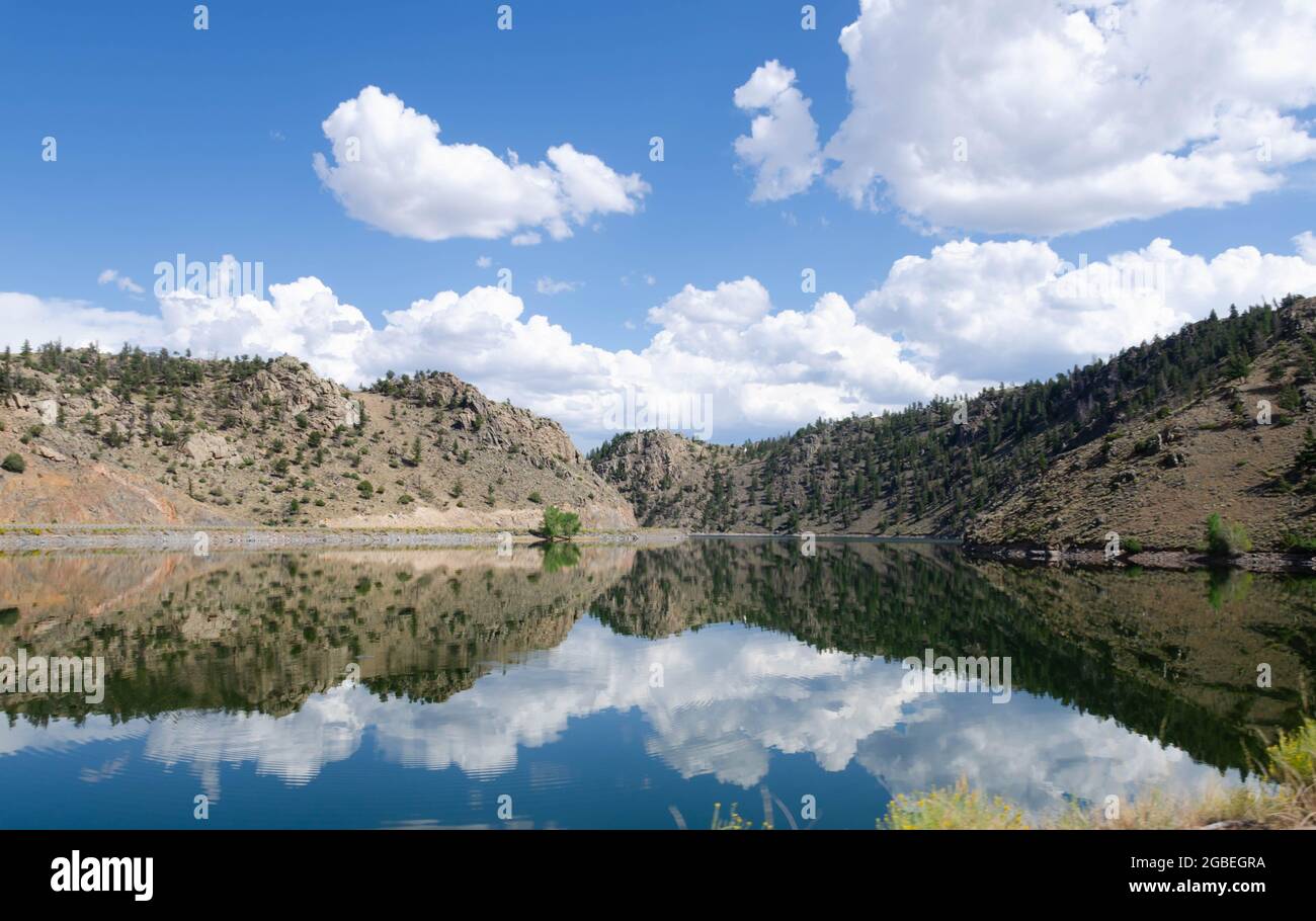 Landscape scene with lake and dramatic clouds. Beautiful scenic ...