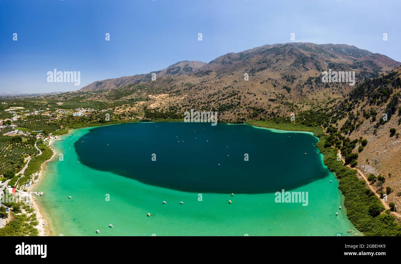 Panoramic aerial view of a huge freshwater lake surrounded by tall ...