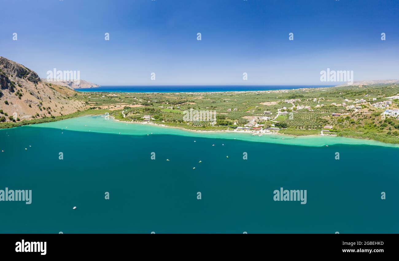 Panoramic aerial view of a huge freshwater lake surrounded by tall ...