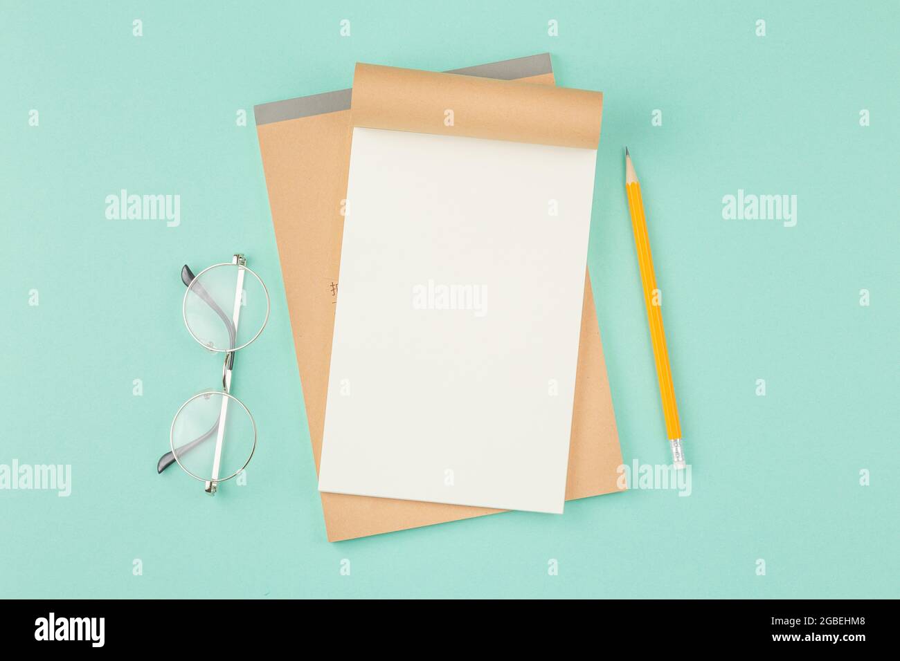 Open school notebook with pencil Stock Photo - Alamy