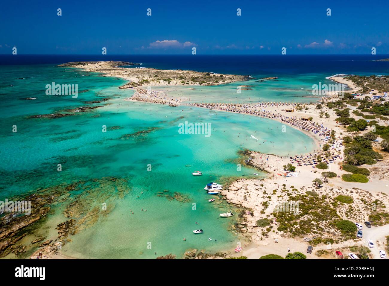 Aerial view of a beautiful but busy sandy beach and shallow lagoons ...