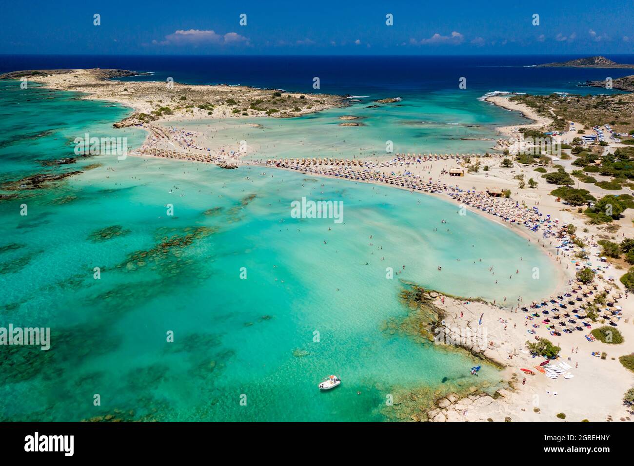 Aerial view of a beautiful but busy sandy beach and shallow lagoons ...