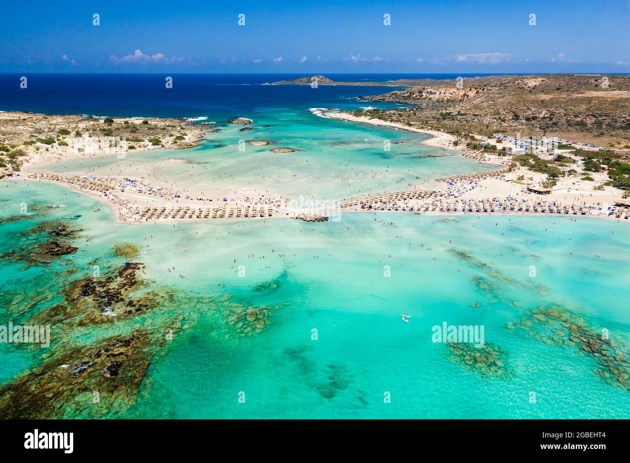 Aerial view of a beautiful but busy sandy beach and shallow lagoons ...