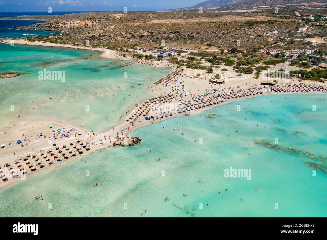 Aerial view of a beautiful but busy sandy beach and shallow lagoons ...