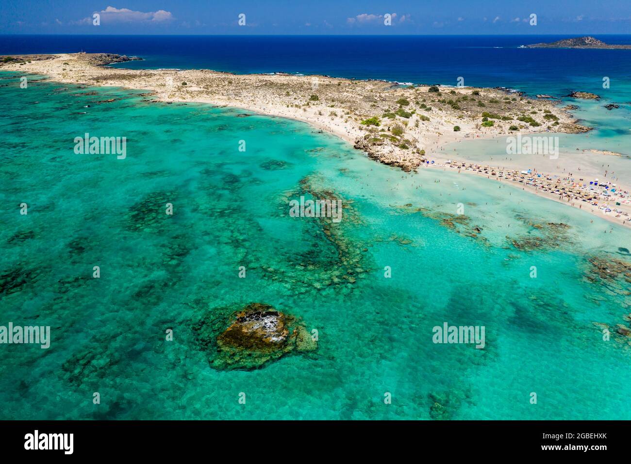 Aerial view of a beautiful but busy sandy beach and shallow lagoons ...