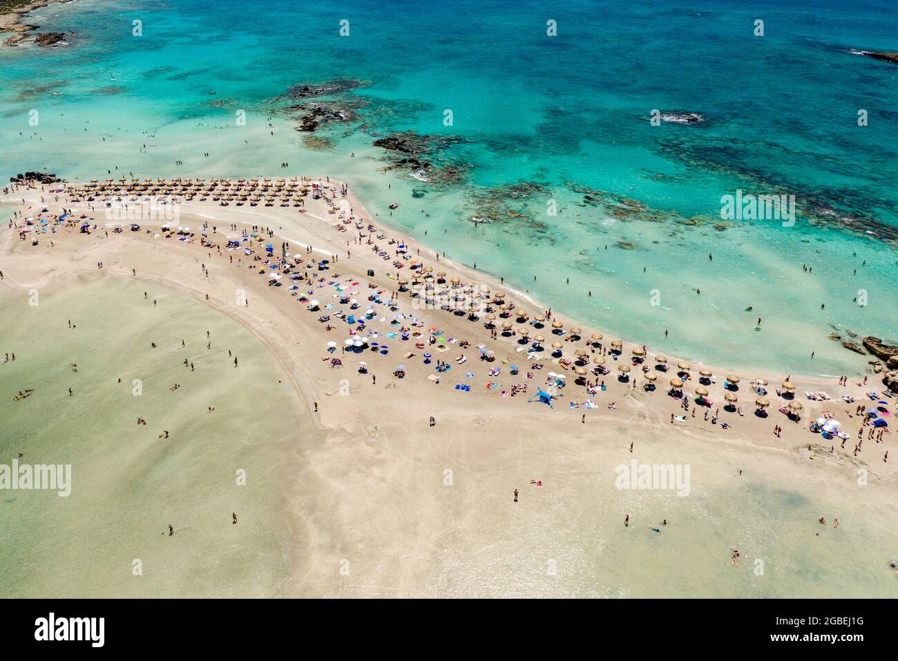 Aerial view of a beautiful but busy sandy beach and shallow lagoons ...