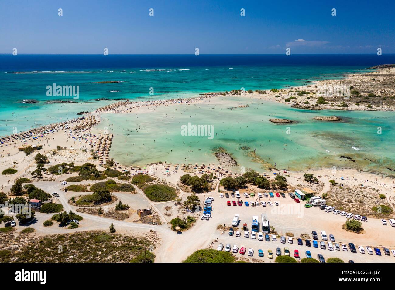 Aerial view of a beautiful but busy sandy beach and shallow lagoons ...