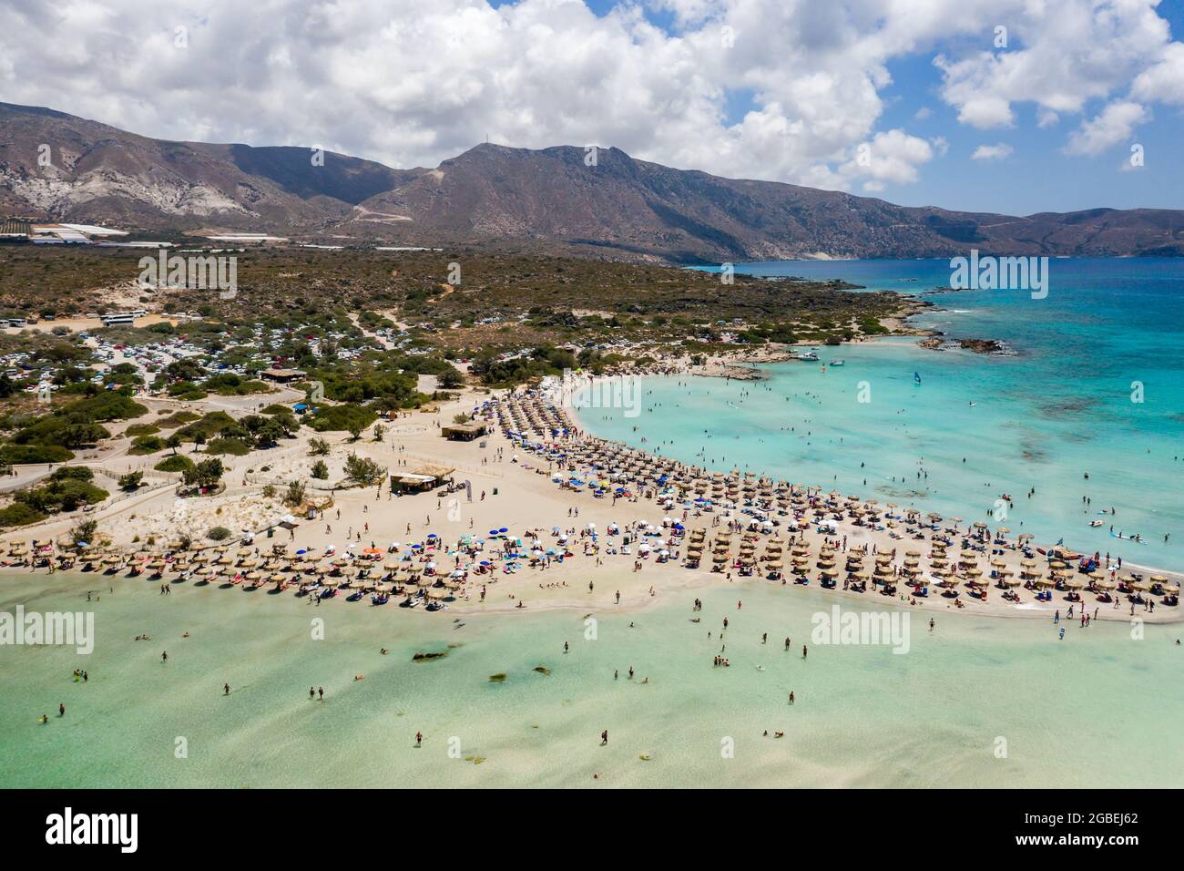 Aerial view of a beautiful but busy sandy beach and shallow lagoons ...