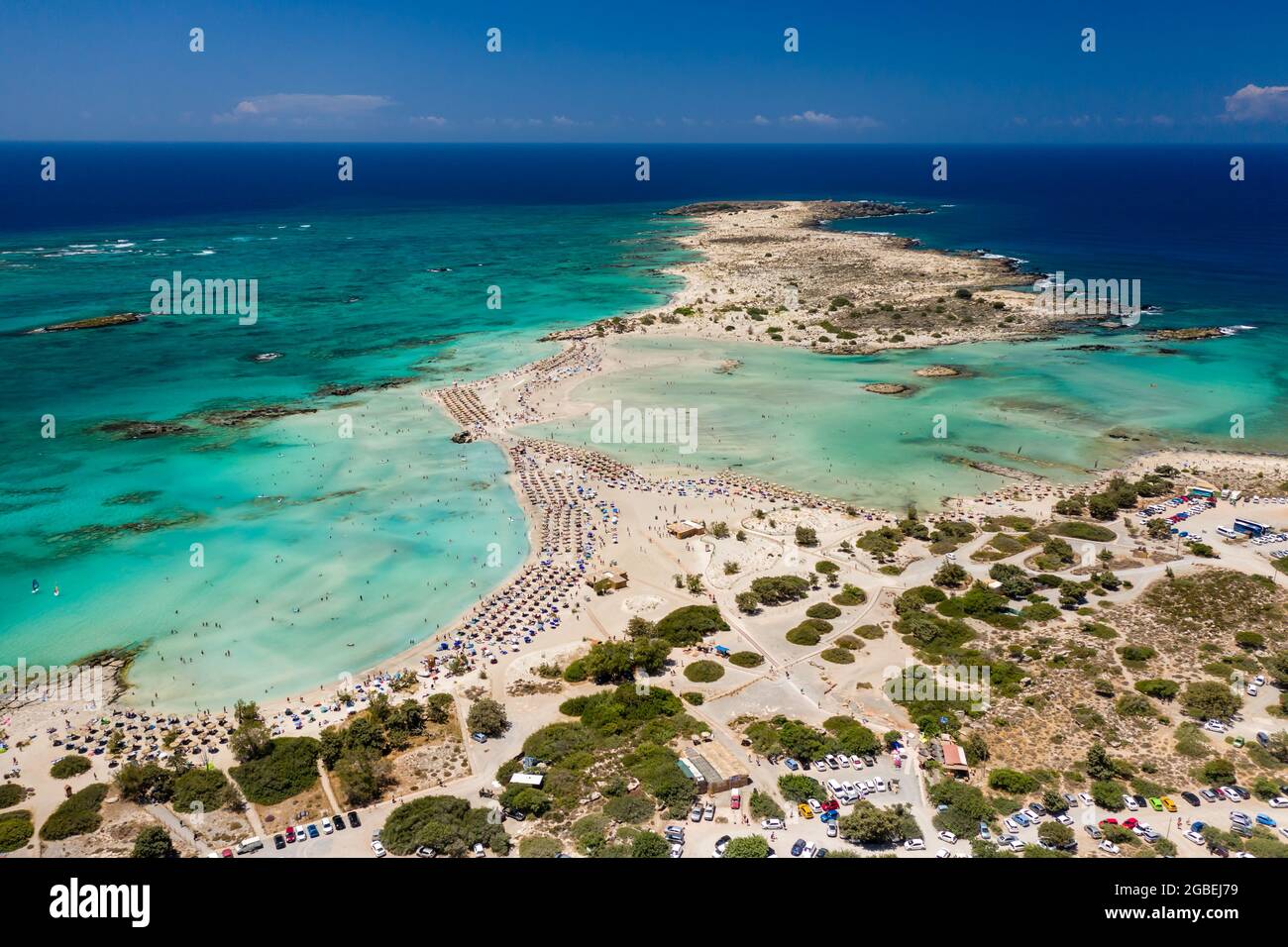Aerial view of a beautiful narrow sandy beach and shallow, warm lagoons ...