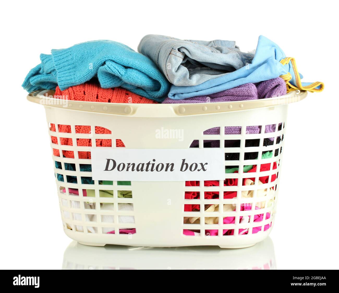 Donation box with clothing isolated on white Stock Photo - Alamy