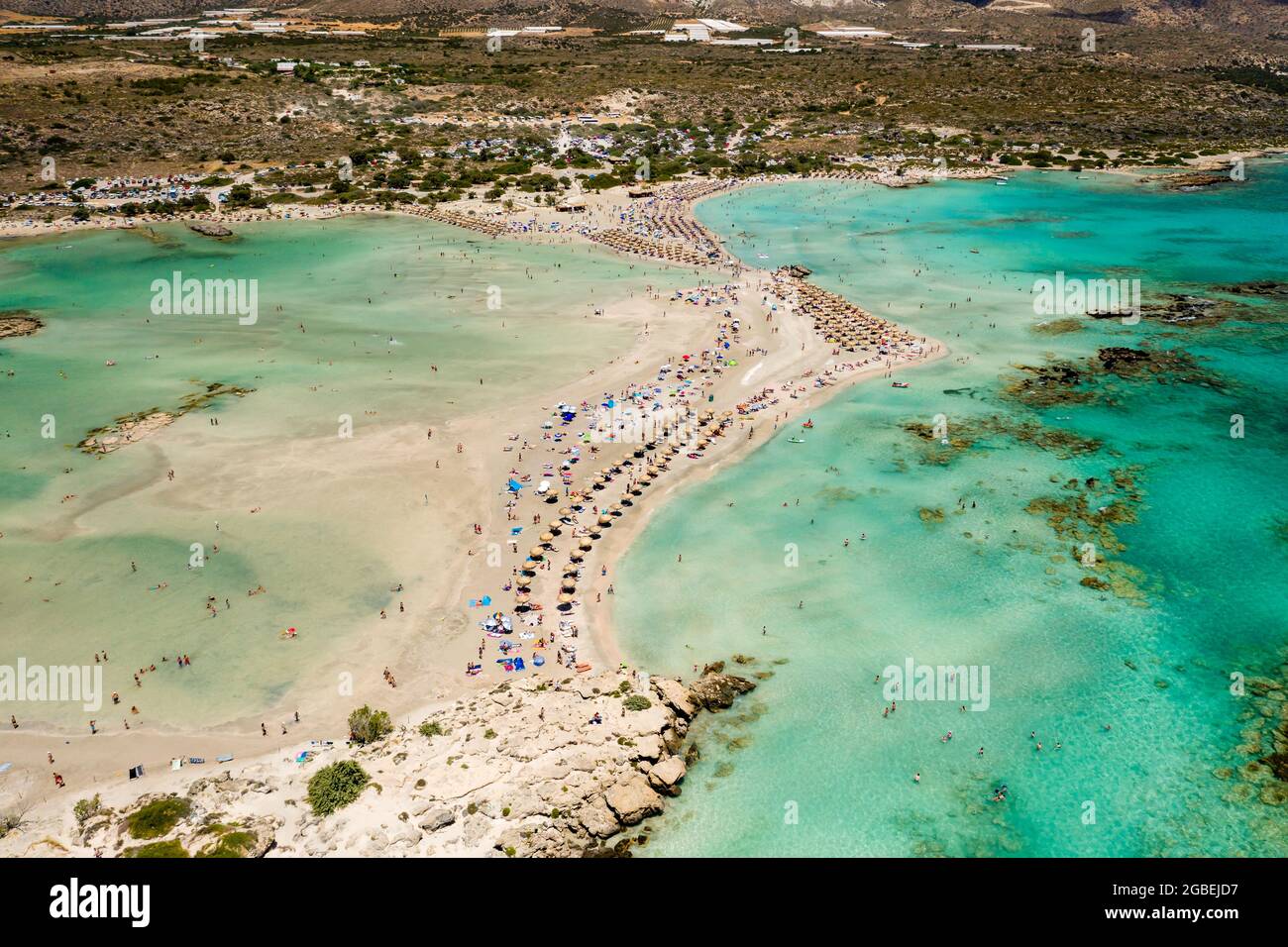Aerial view of a beautiful narrow sandy beach and shallow, warm lagoons ...