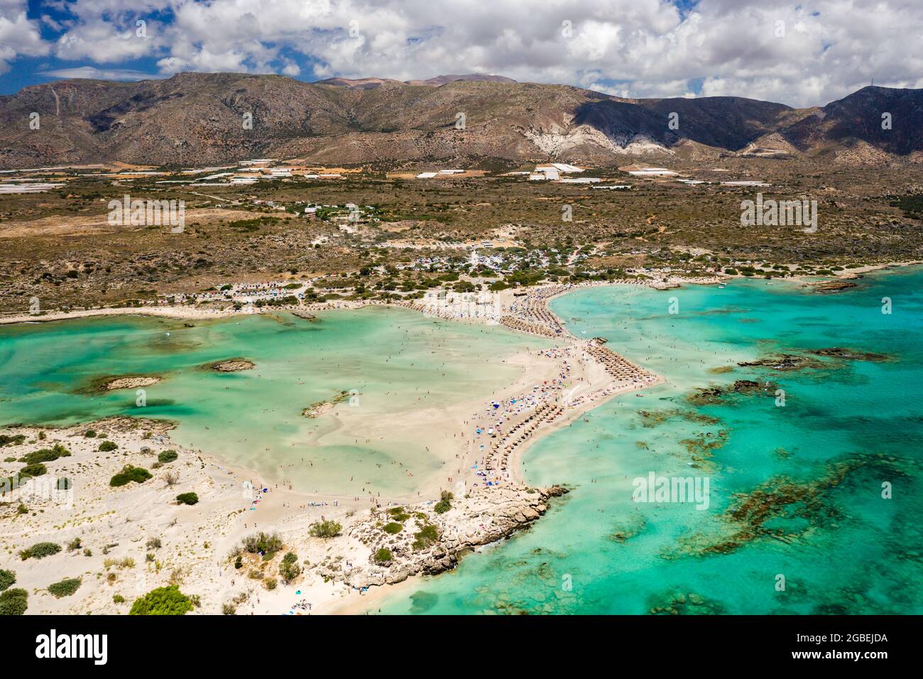 Aerial view of a beautiful narrow sandy beach and shallow, warm lagoons ...