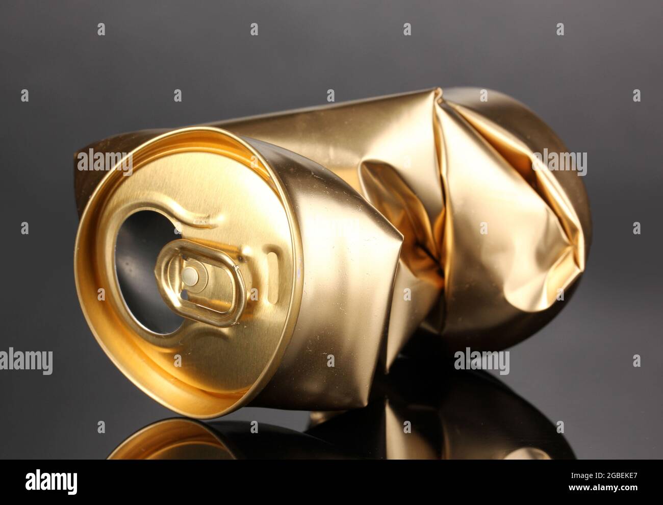 crumpled empty can on grey background Stock Photo - Alamy