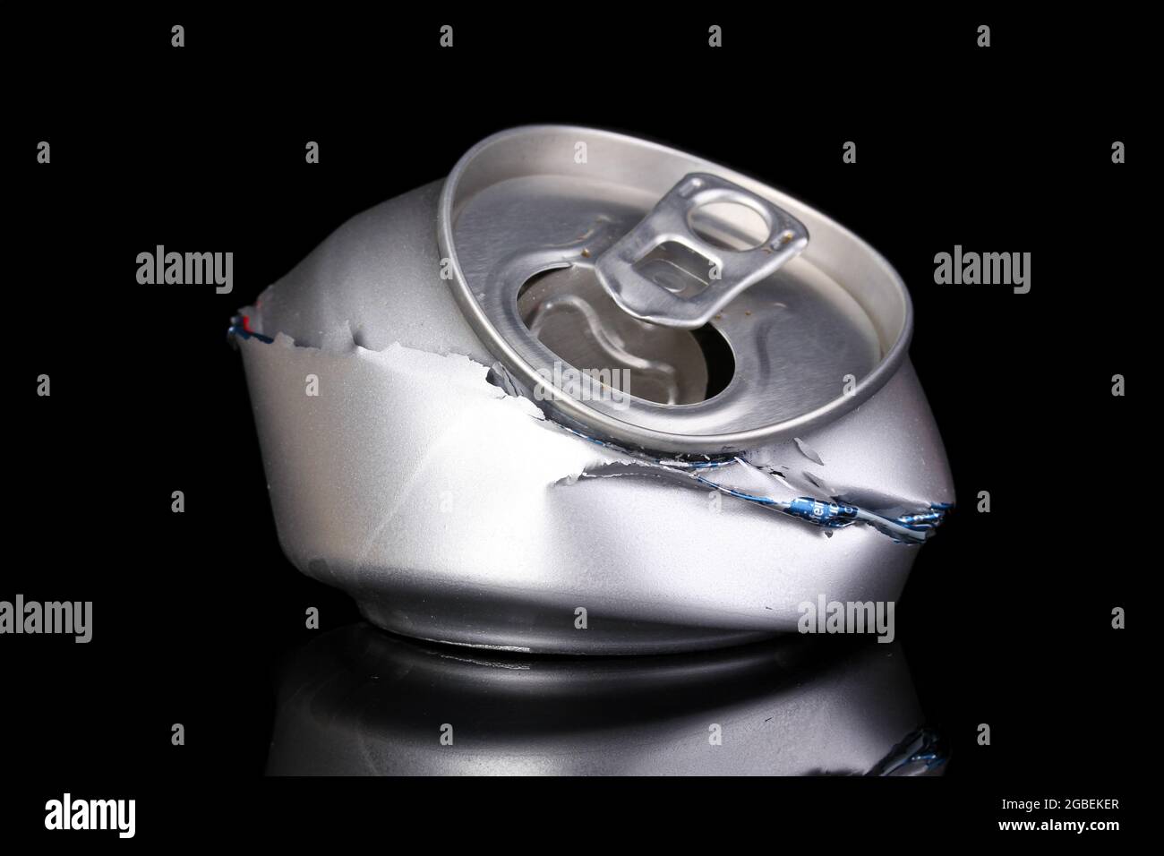 crumpled empty can isolated on black Stock Photo - Alamy