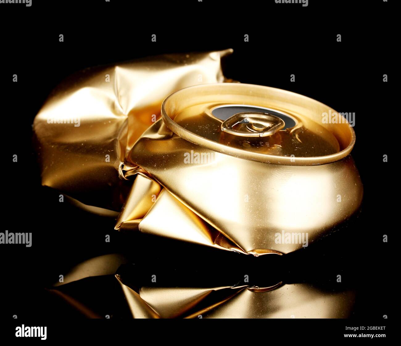 crumpled empty can isolated on black Stock Photo - Alamy