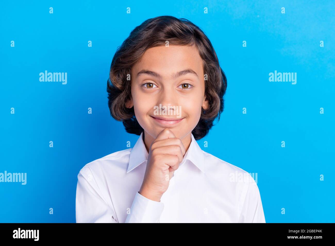 Photo of cute attentive school boy wear formal outfit smiling arm chin ...