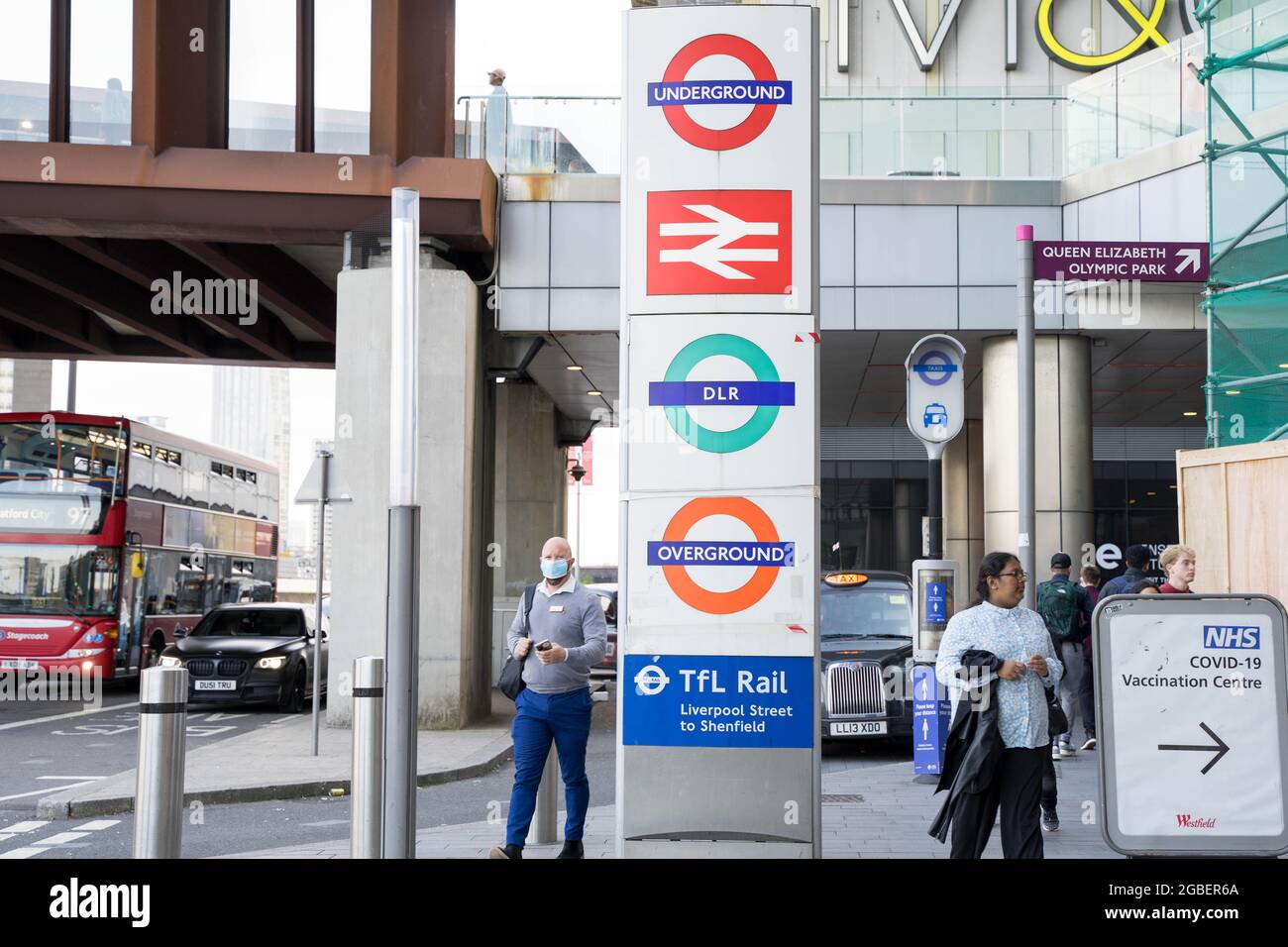 commuters and Multiple London transport rundles signs at Stratford ...