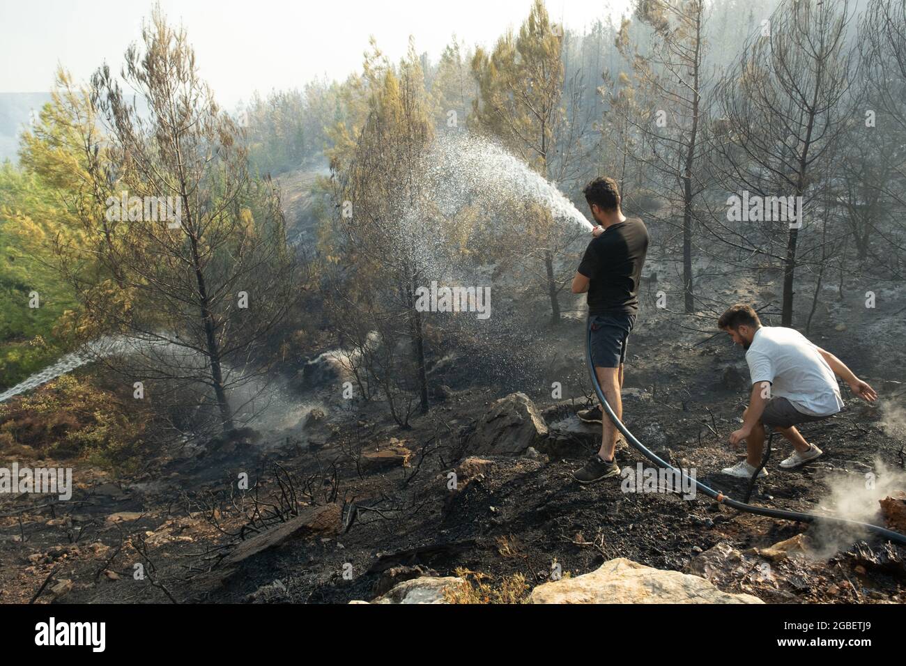 Mugla, Turkey - August 1, 2021. Fire fighting people on ground on ...