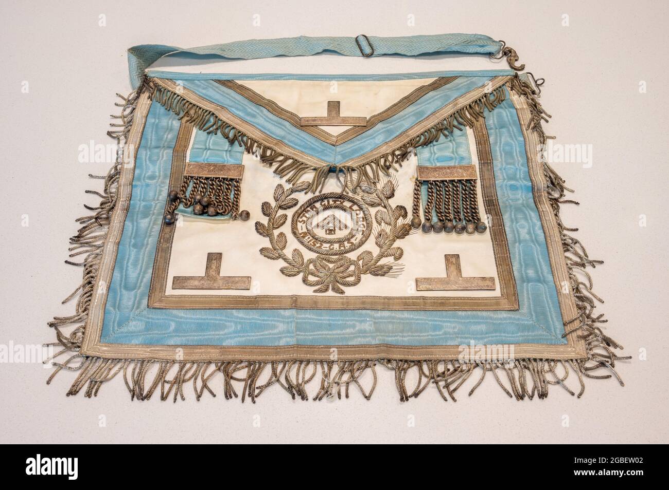 Decades old masonic apron on white background Stock Photo - Alamy