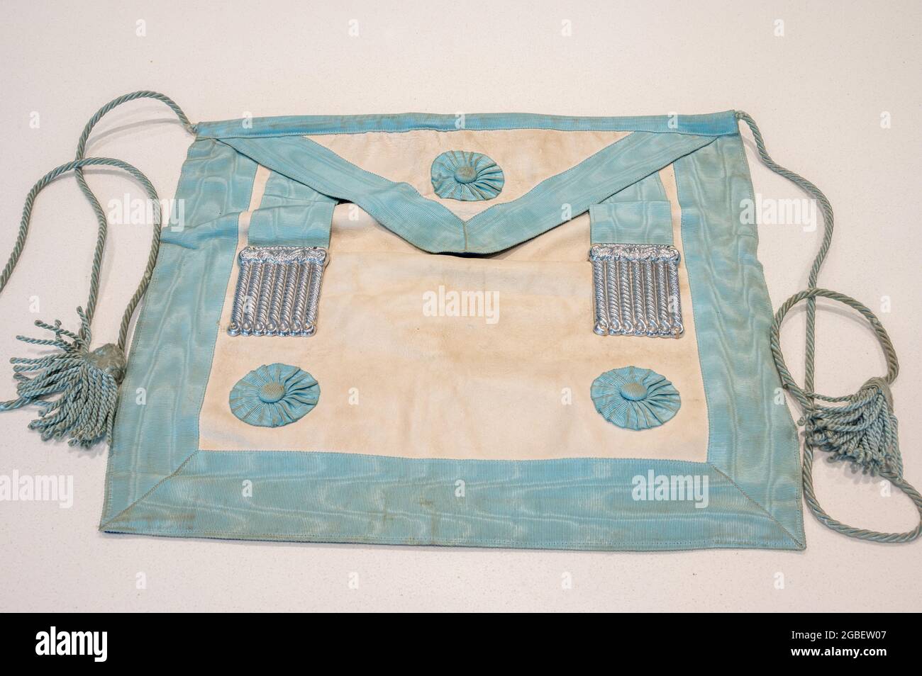 Decades old masonic apron on white background Stock Photo - Alamy
