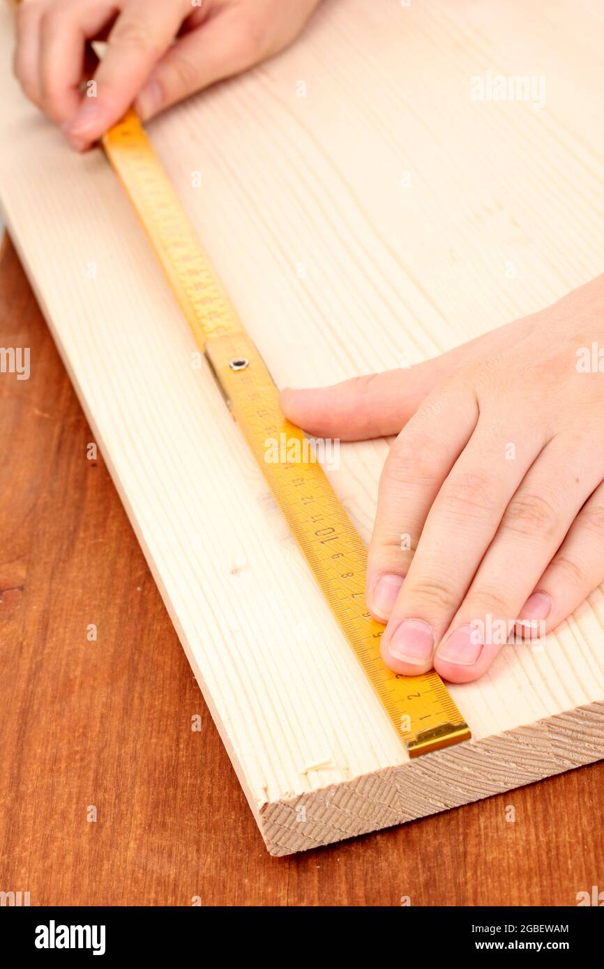 measuring wooden board close-up Stock Photo - Alamy