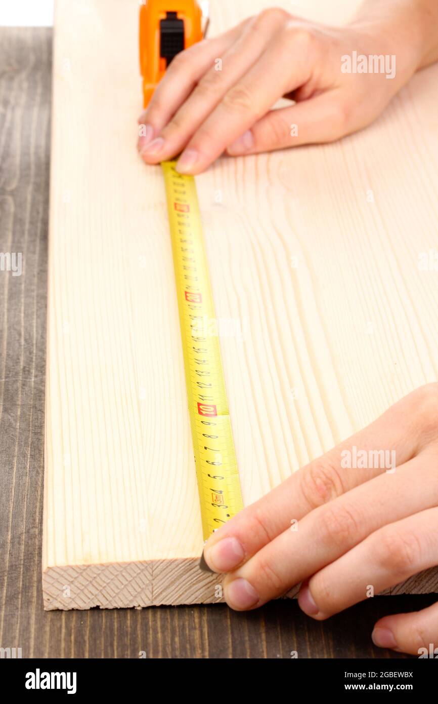 measuring wooden board close-up Stock Photo - Alamy