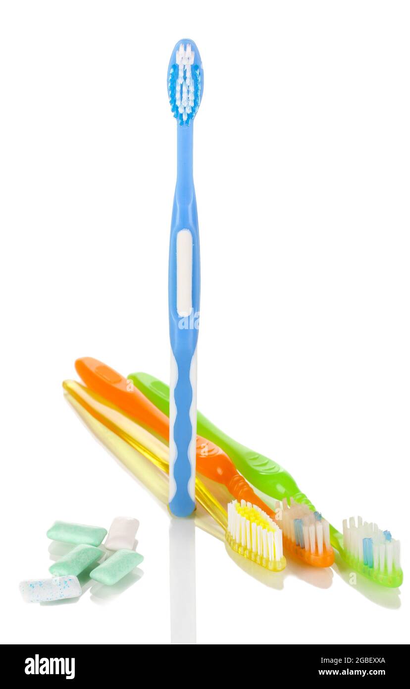 Toothbrushes and chewing gum isolated on white Stock Photo - Alamy