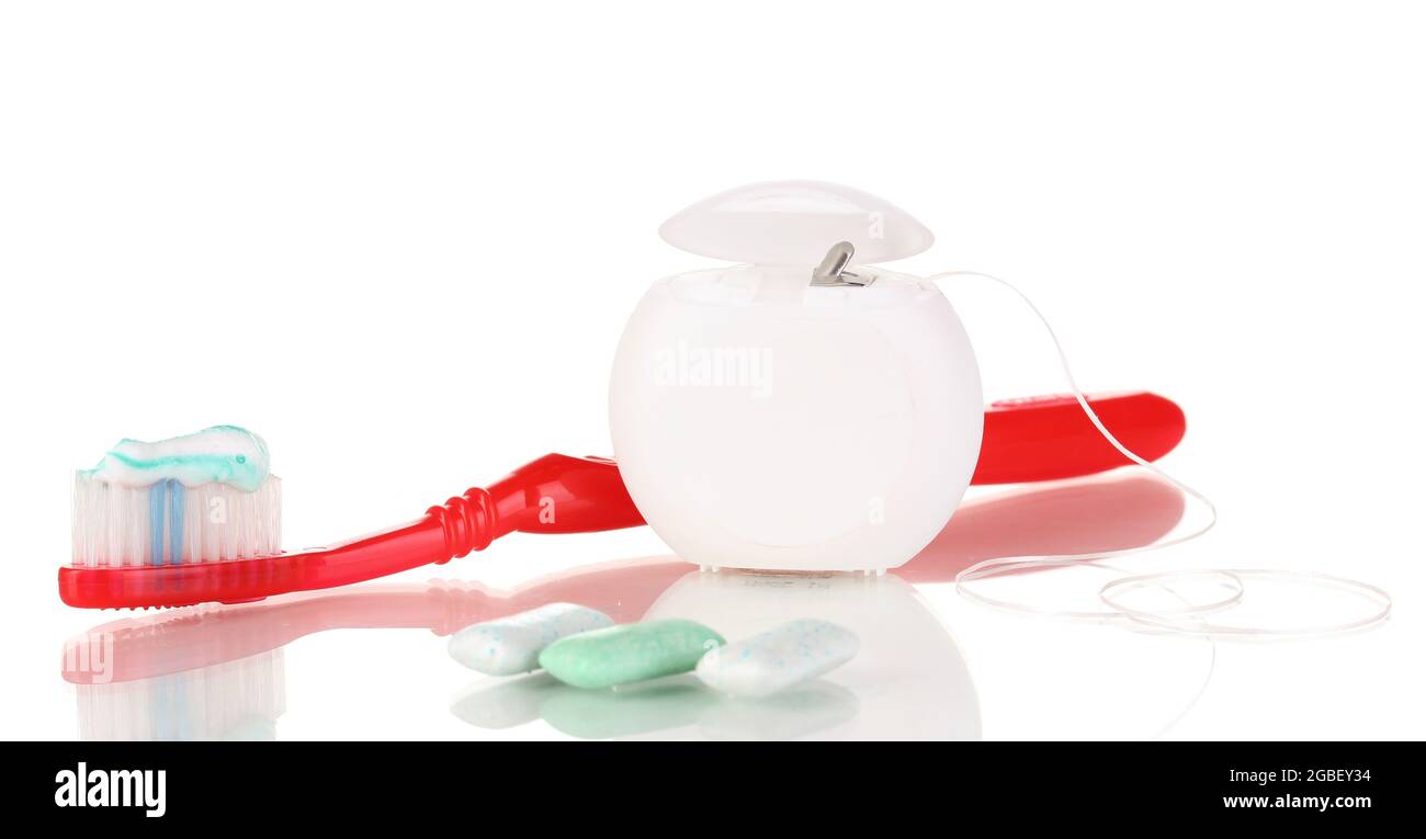 Toothbrush, chewing gum and dental floss isolated on white Stock Photo ...