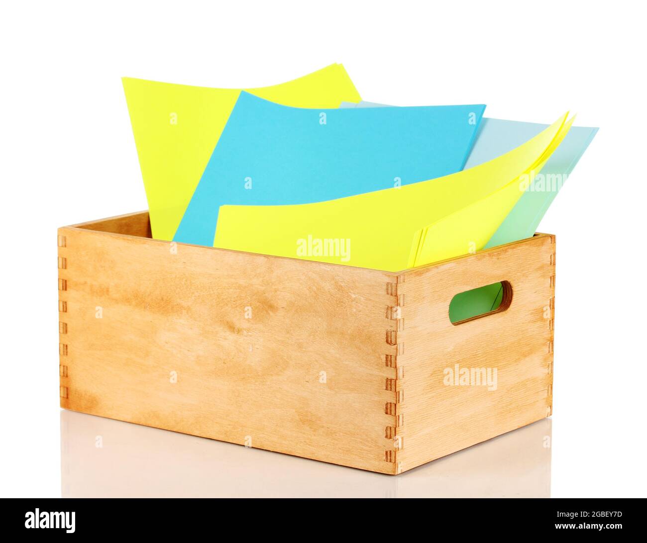 Wooden crate with colorful papers isolated on white Stock Photo - Alamy