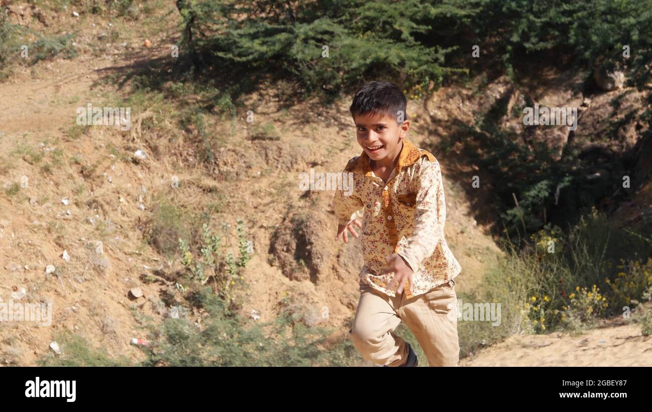 Happy small kid running outdoor Stock Photo - Alamy