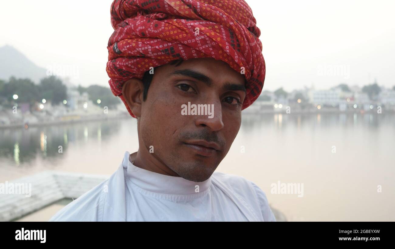 Indian man looking at the camera with a serious fac Stock Photo - Alamy