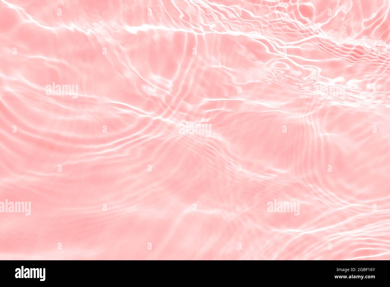 Surface of light toned in pink transparent swimming pool water texture ...