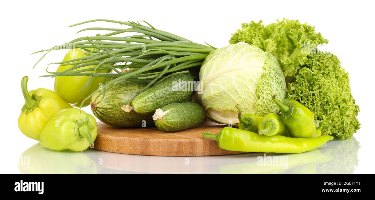 fresh green vegetables on chopping board isolated on white Stock Photo - Alamy